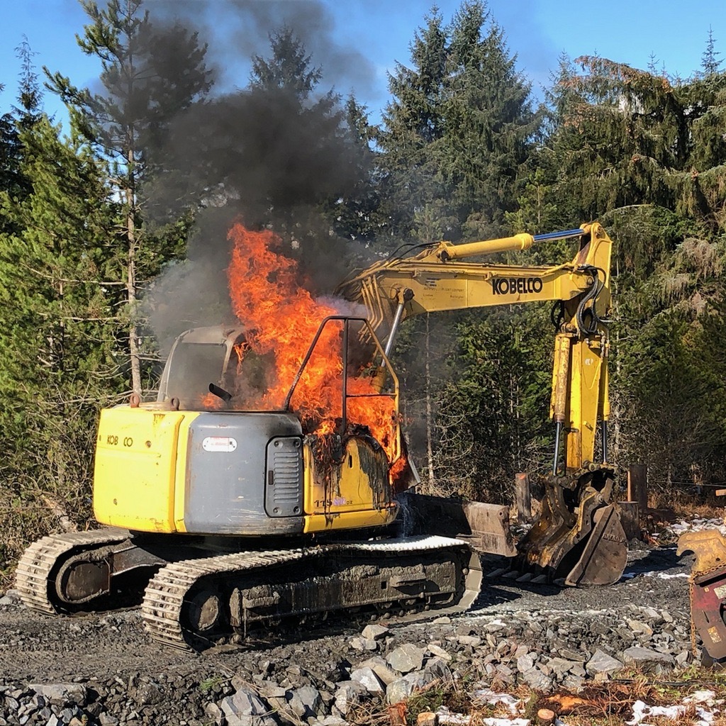 Petersburg volunteer fire fighters respond to a excavator on fire - KFSK